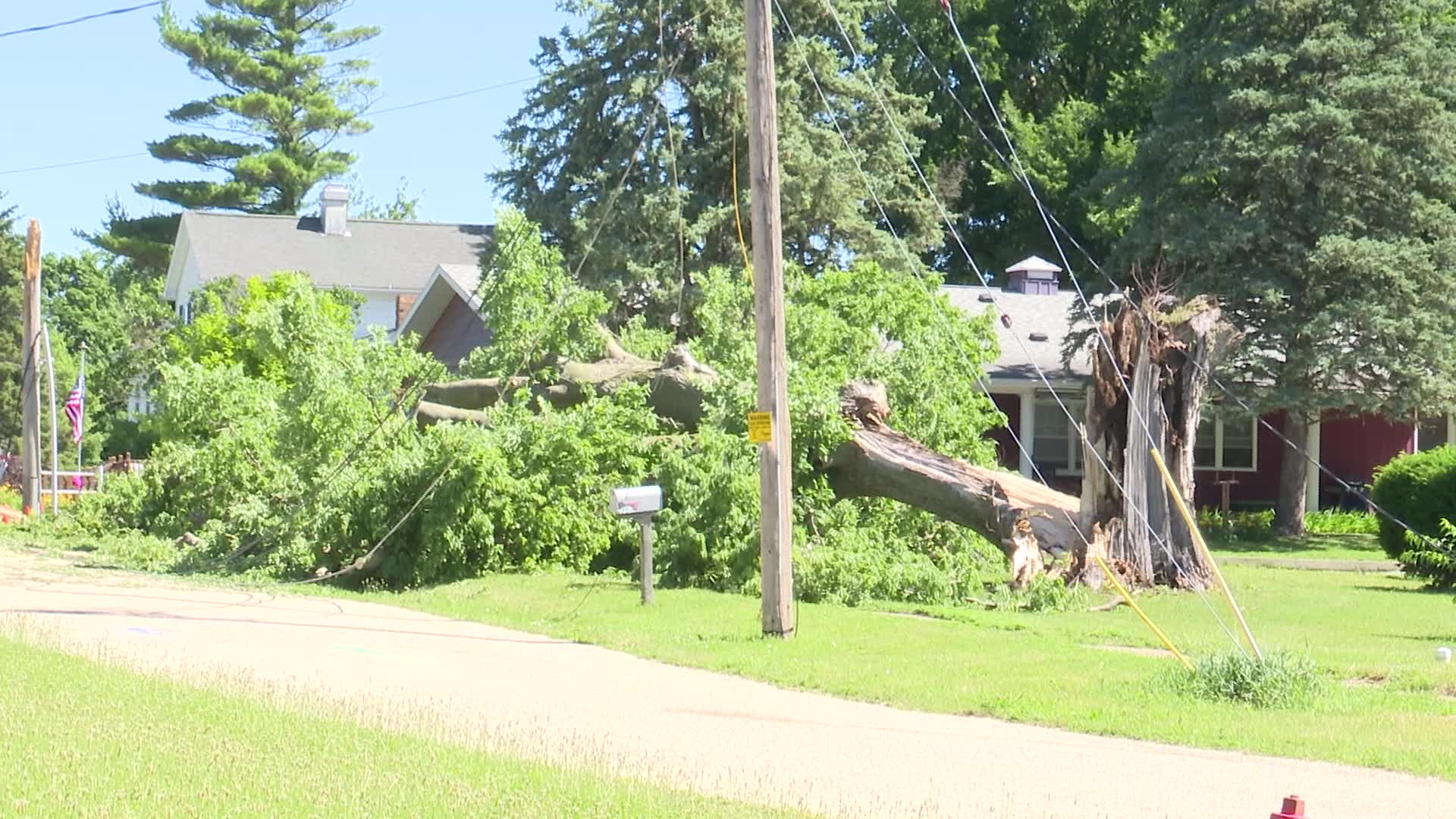 Residents pick up debris and clean up after strong storms hit Thursday ...